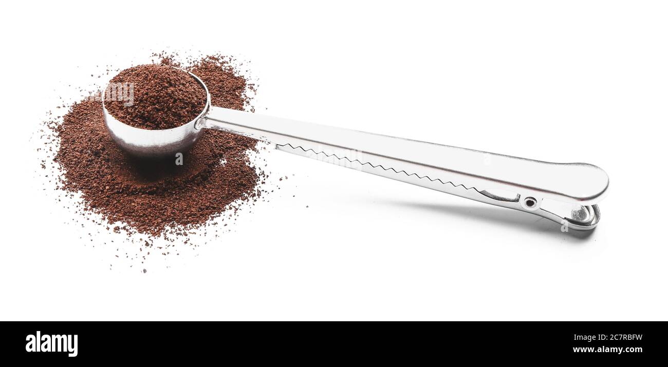 Scoop with coffee powder on white background Stock Photo - Alamy
