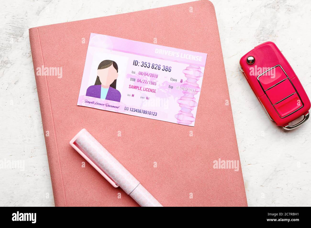 Driving license with notebook and car key on white background Stock ...