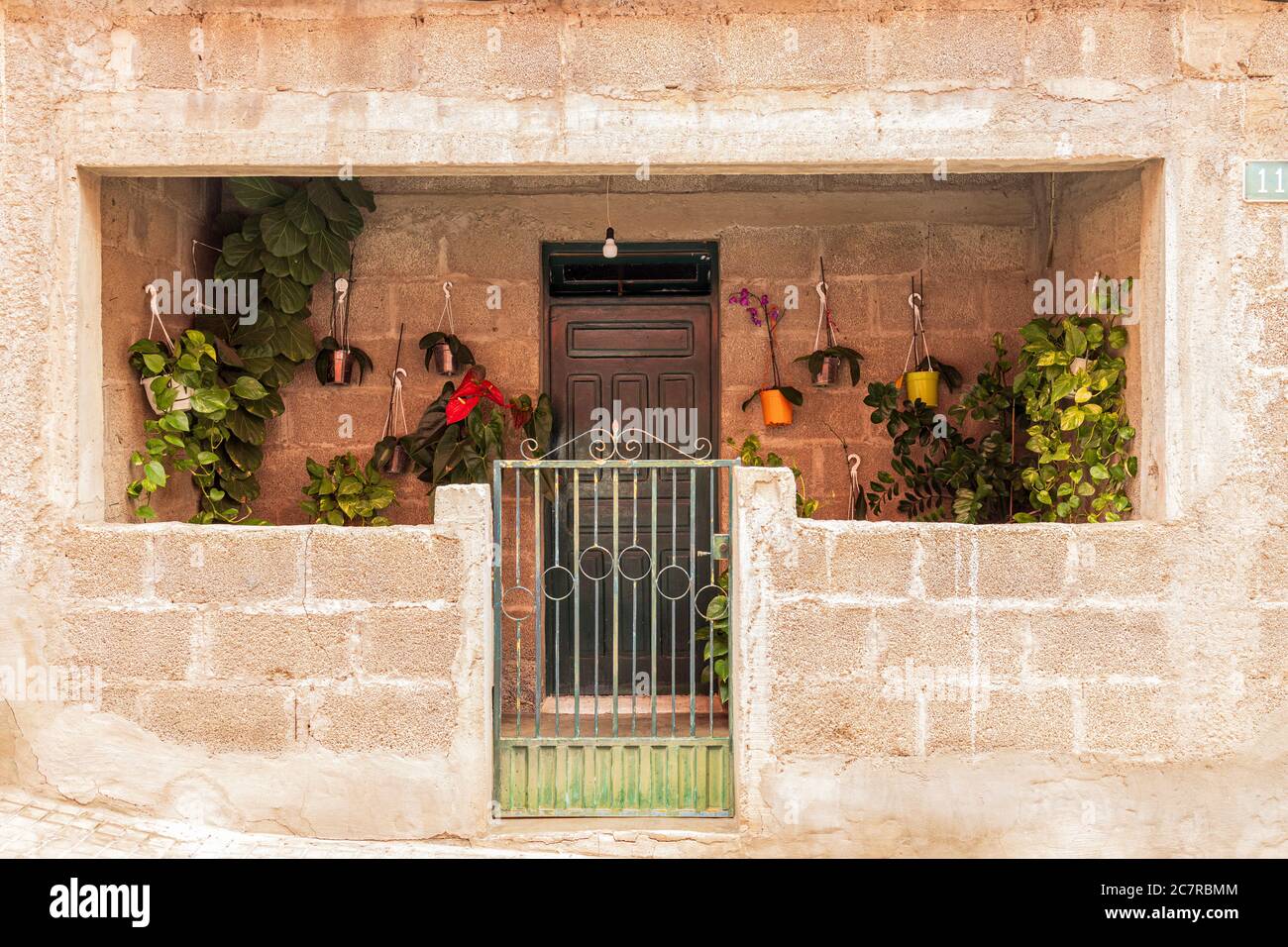 Unrendered brick and concrete built single storey house with lots of ...