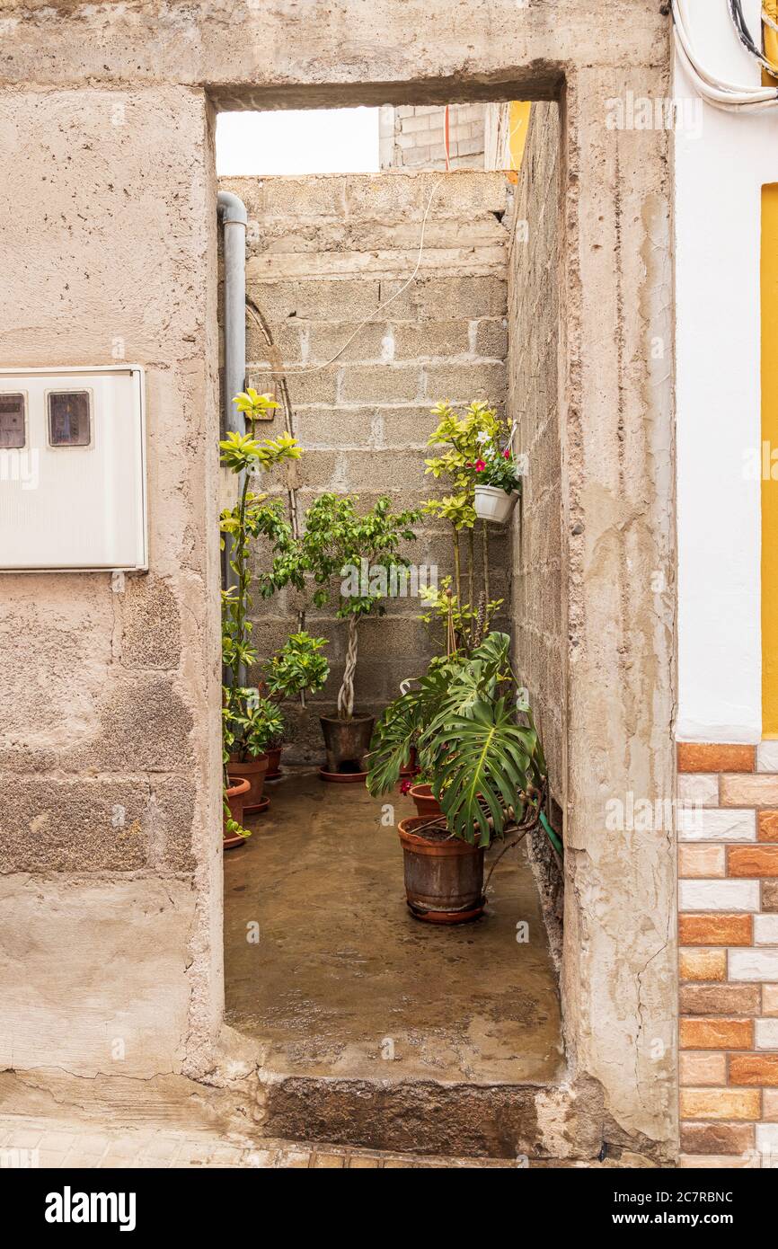 Unrendered brick and concrete built single storey house with lots of ...