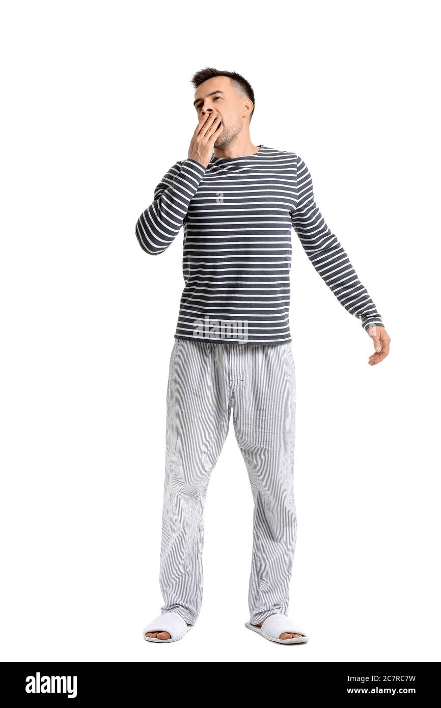 Young man suffering from sleep deprivation on white background Stock ...