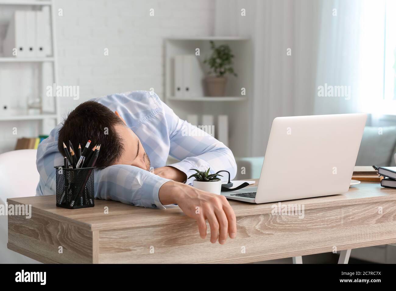 Tired businessman laptop falling asleep hi-res stock photography and ...