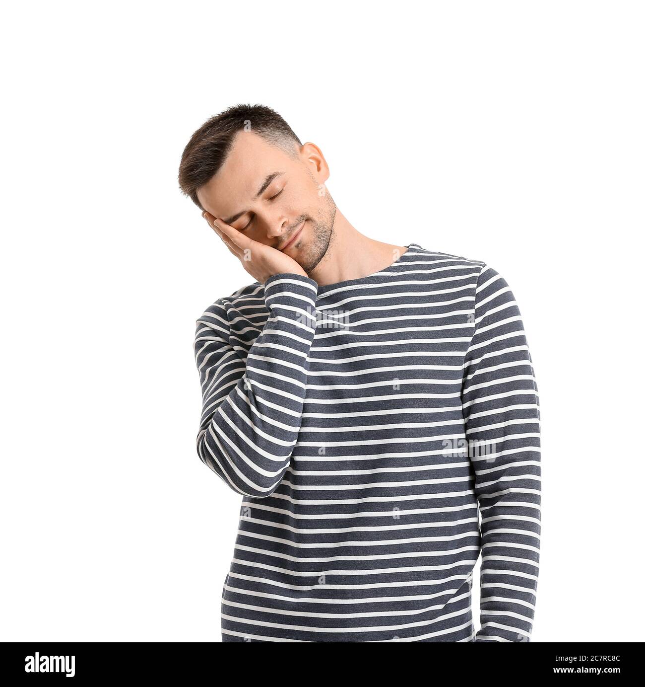 Young man suffering from sleep deprivation on white background Stock ...