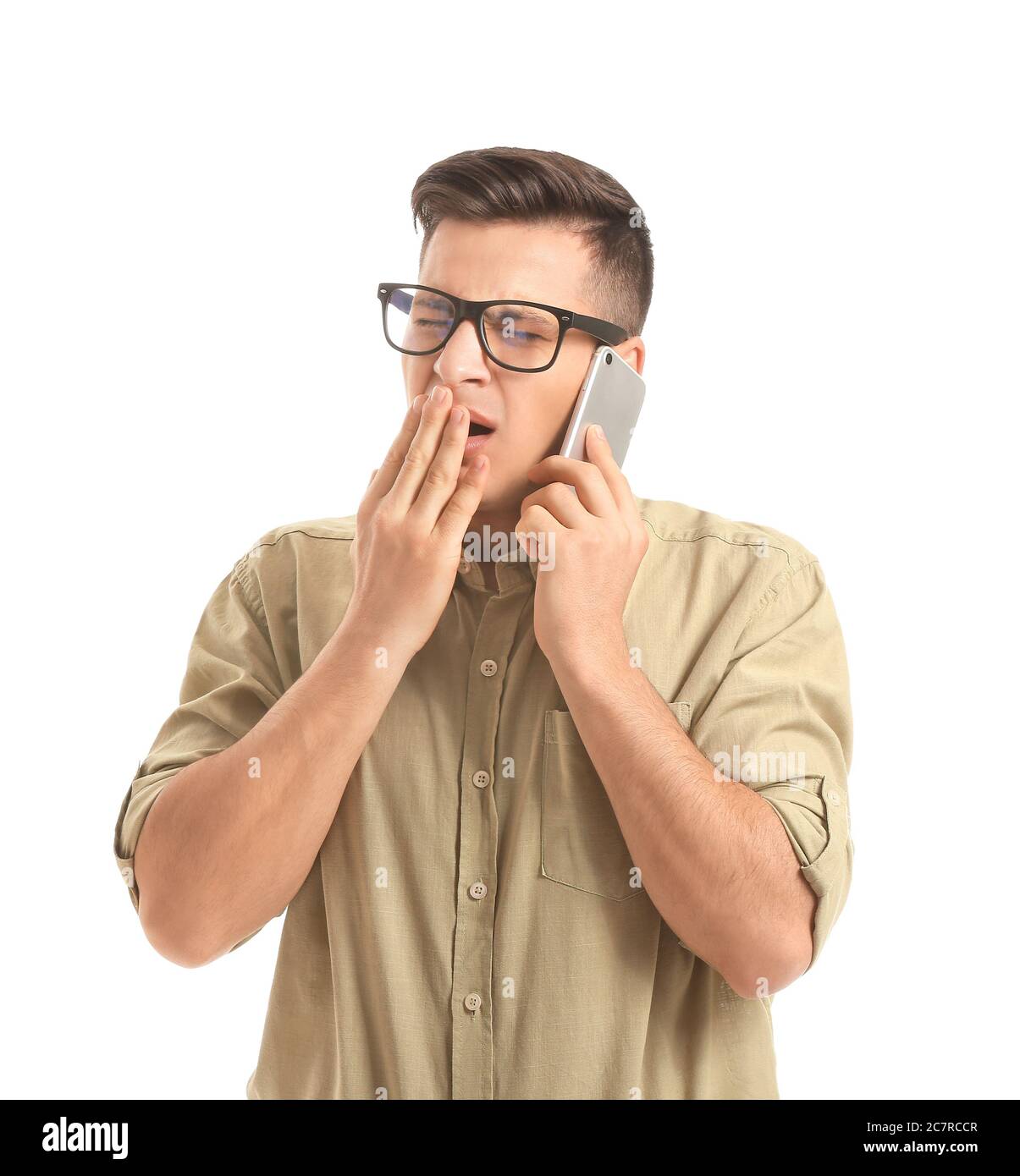Tired man with mobile phone on white background. Concept of sleep ...