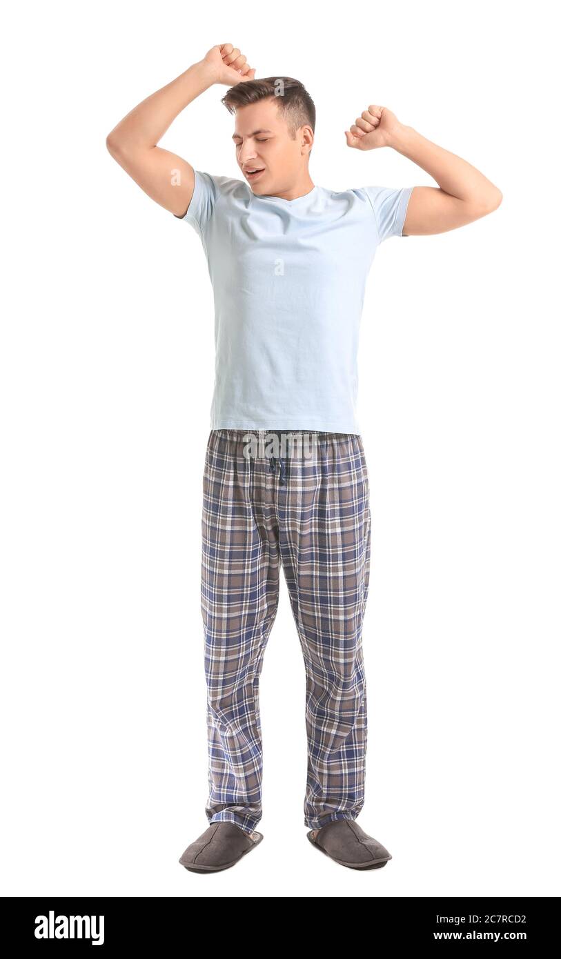 Young man suffering from sleep deprivation on white background Stock ...