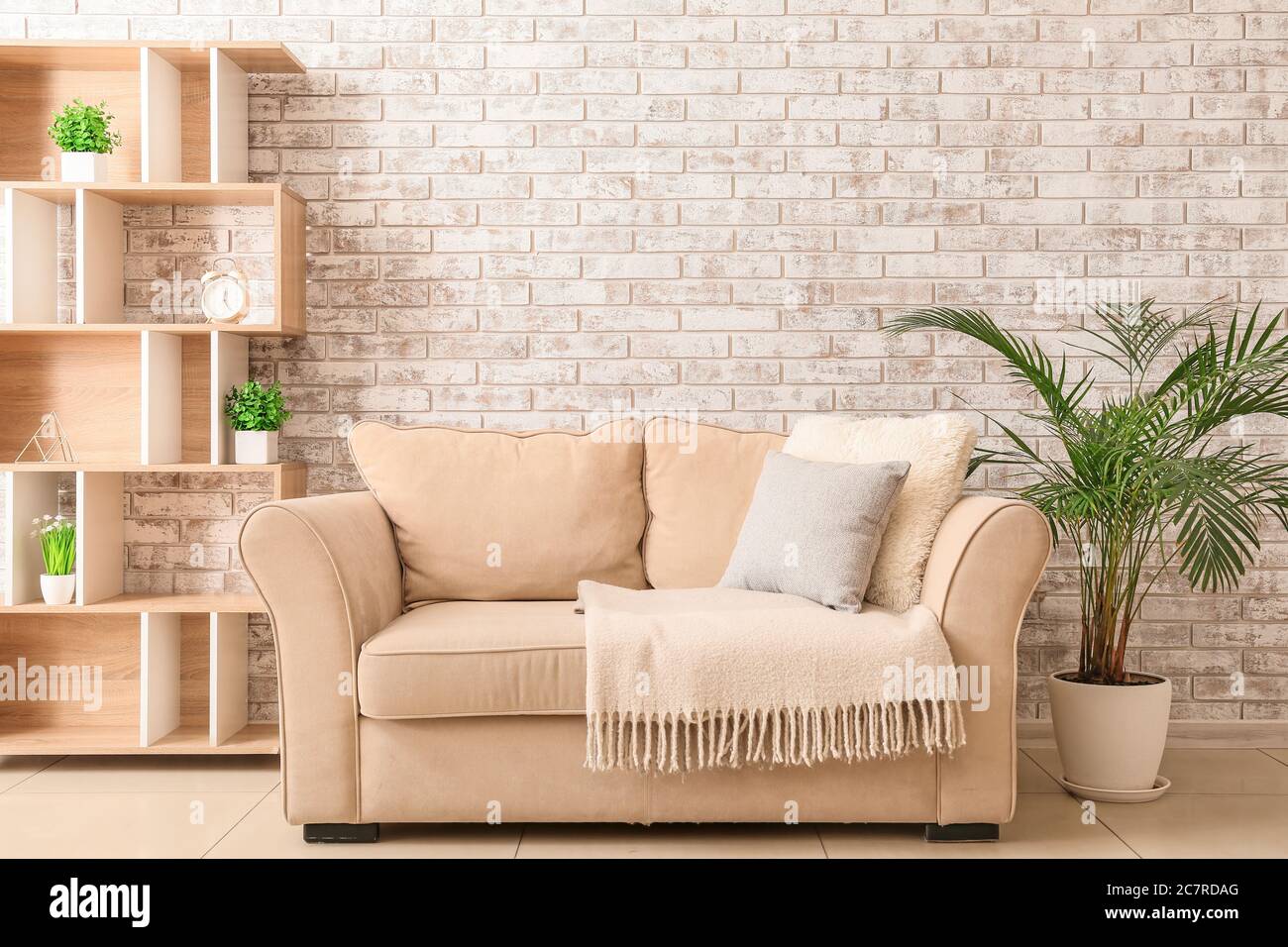 Interior of room with comfortable sofa Stock Photo - Alamy
