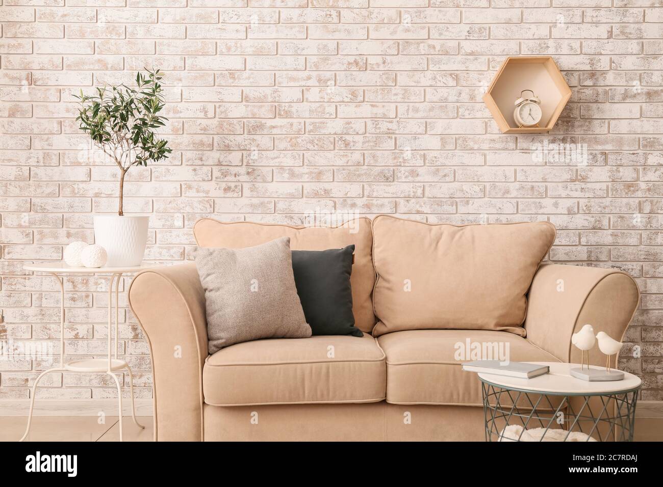 Interior of room with comfortable sofa Stock Photo - Alamy