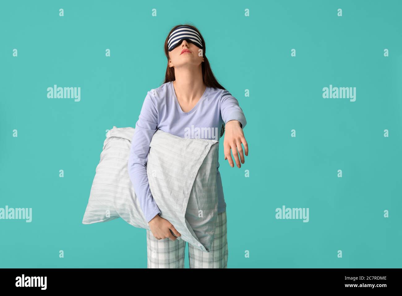 Female sleepwalker on color background Stock Photo - Alamy