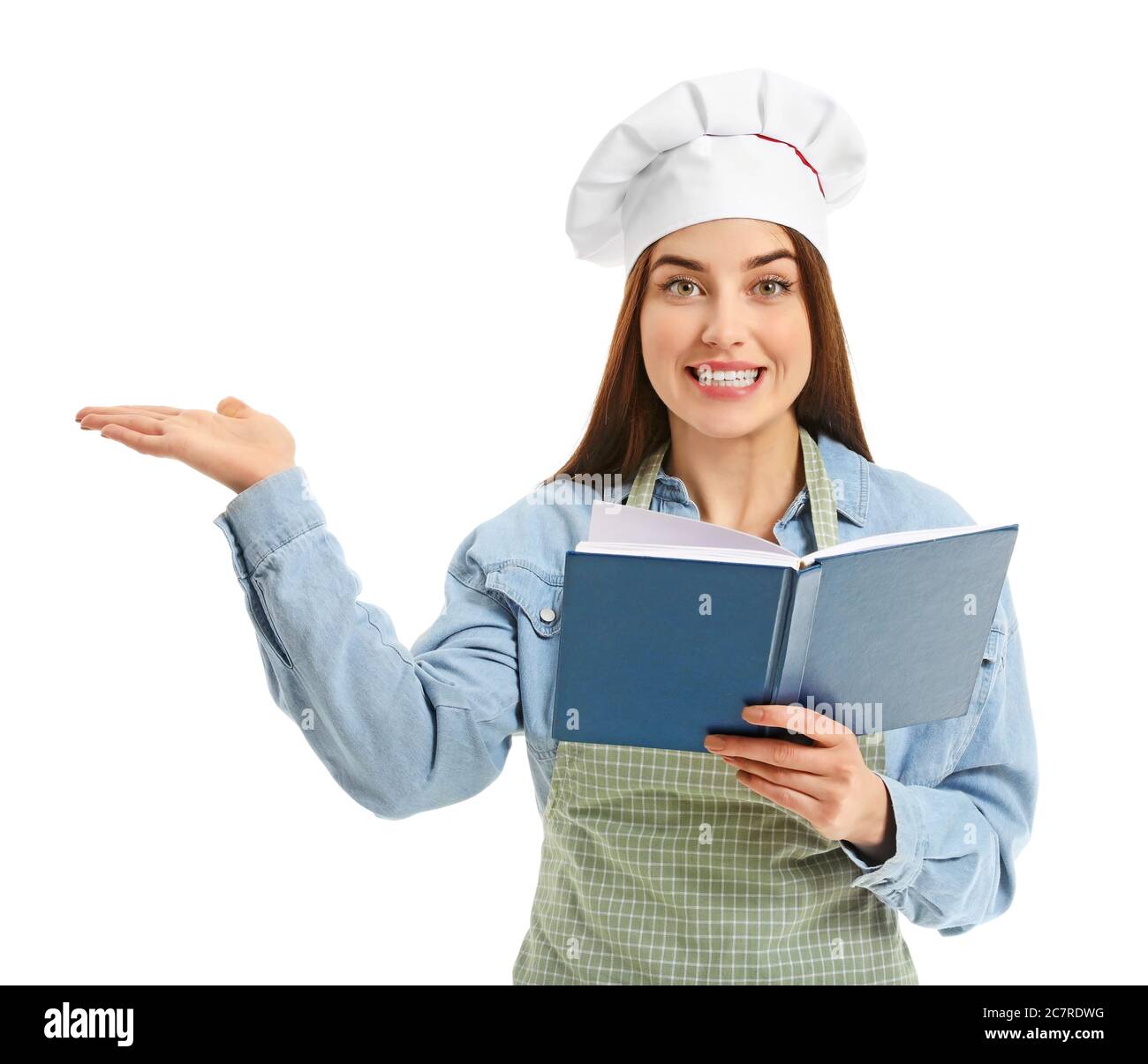 Young woman with recipe book on white background Stock Photo - Alamy