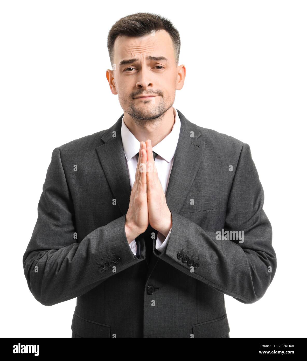 Portrait of apologizing businessman on white background Stock Photo - Alamy