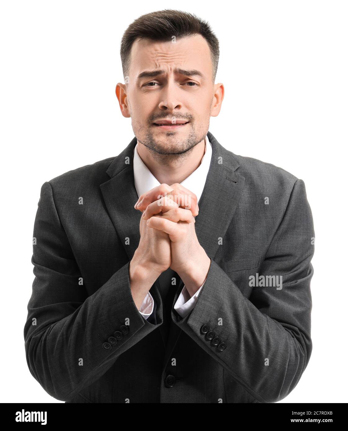 Portrait of apologizing businessman on white background Stock Photo - Alamy