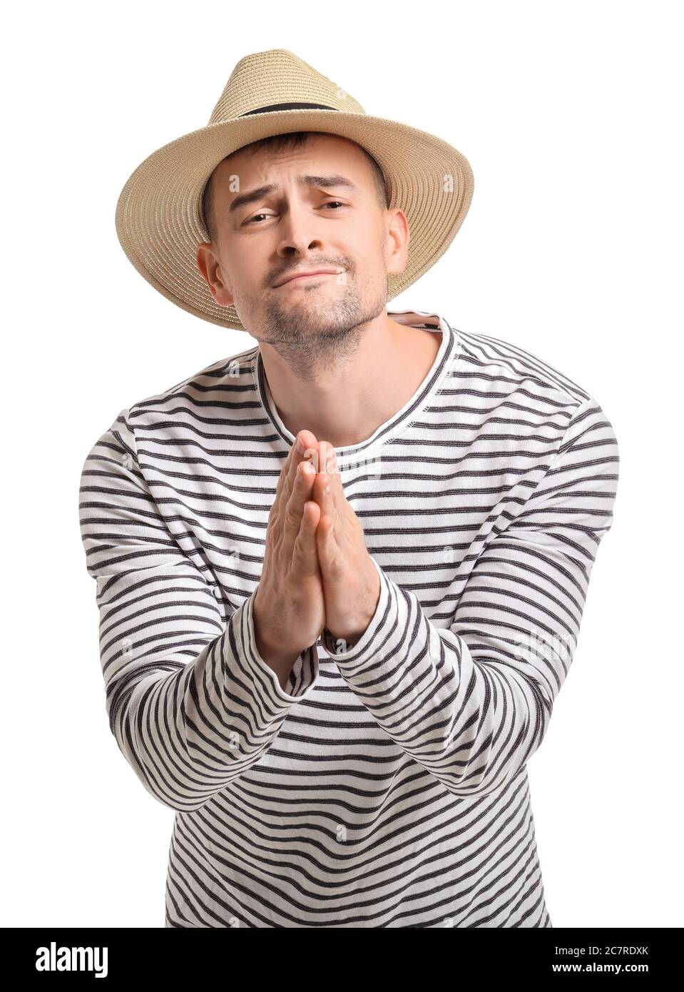 Portrait of apologizing man on white background Stock Photo - Alamy