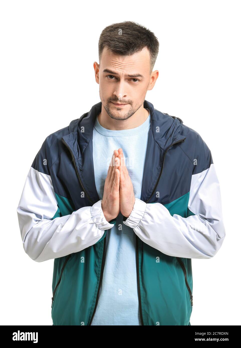 Portrait of apologizing man on white background Stock Photo - Alamy