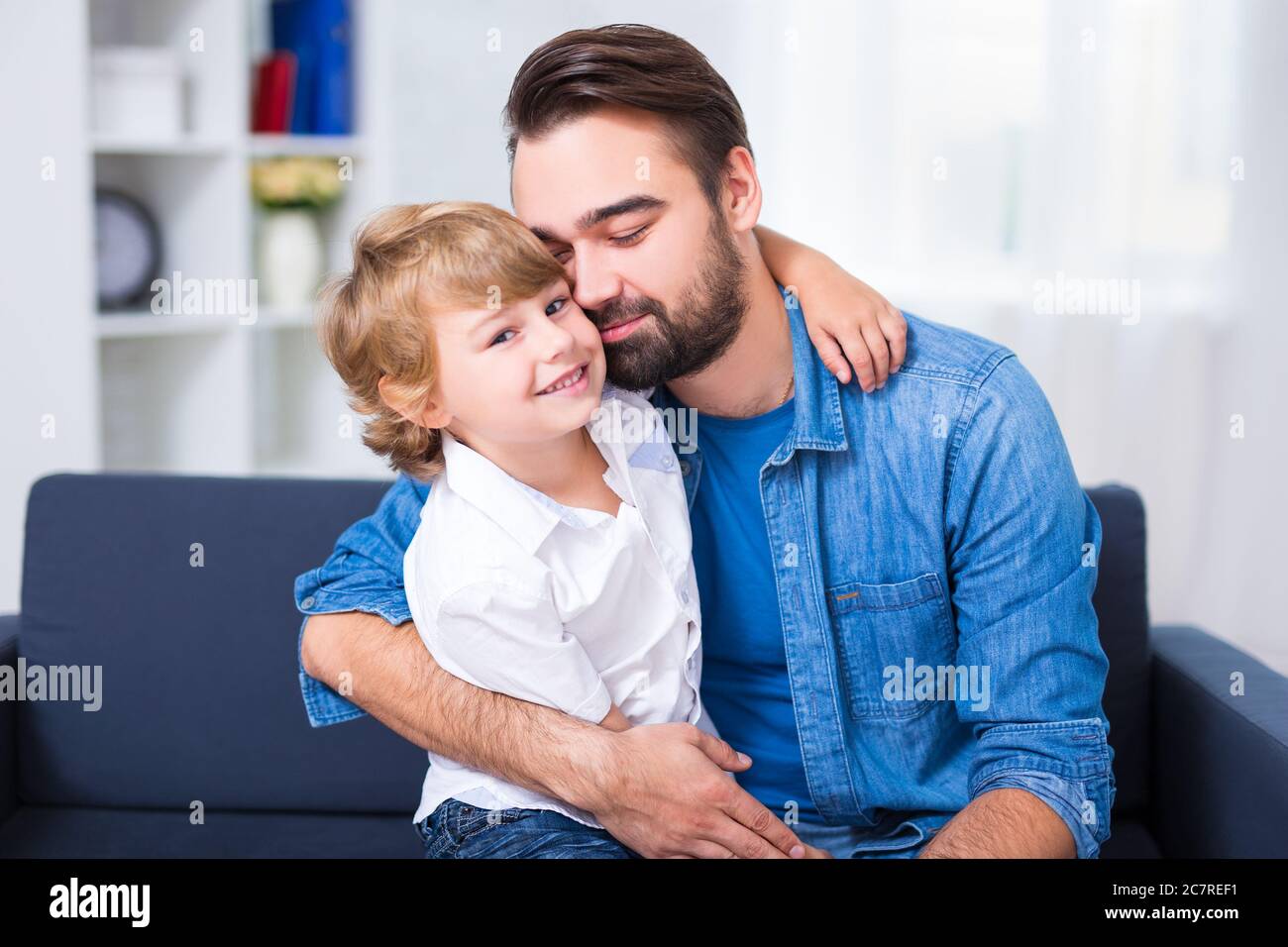 family life - young father embracing his little son Stock Photo - Alamy
