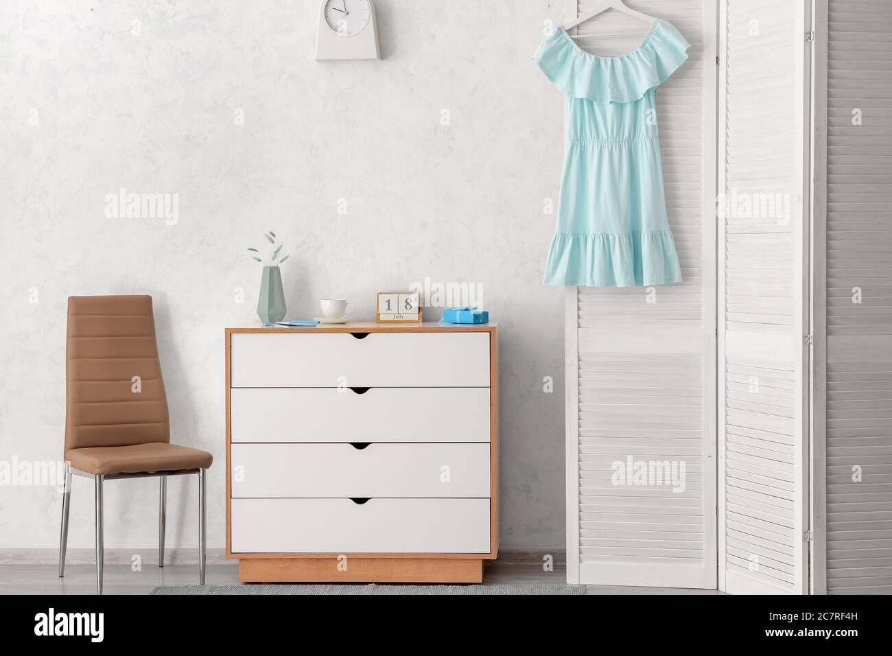 Interior of room with modern chest of drawers Stock Photo - Alamy