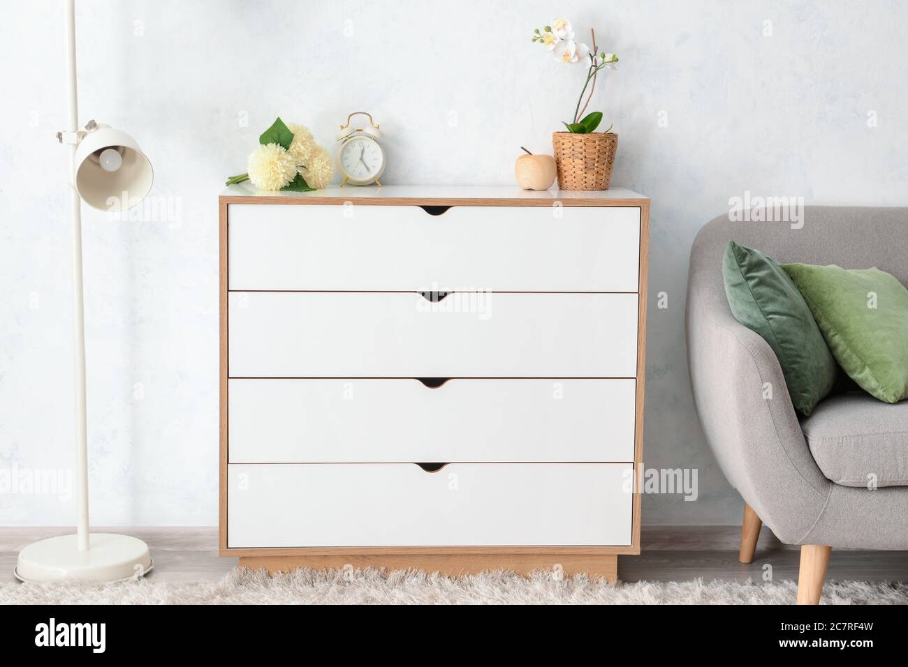 Interior of room with modern chest of drawers Stock Photo - Alamy
