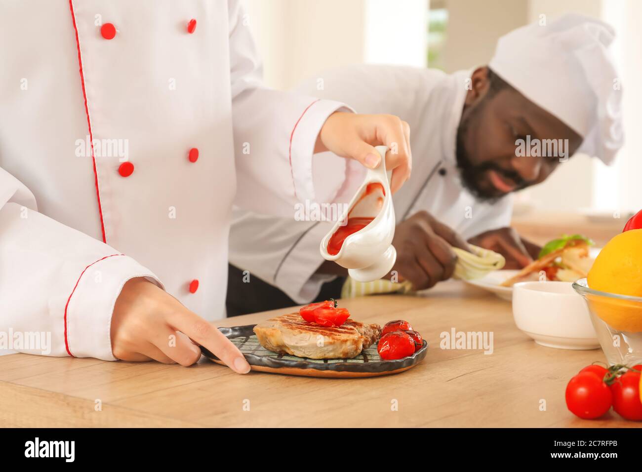 African-American chefs cooking in kitchen Stock Photo - Alamy
