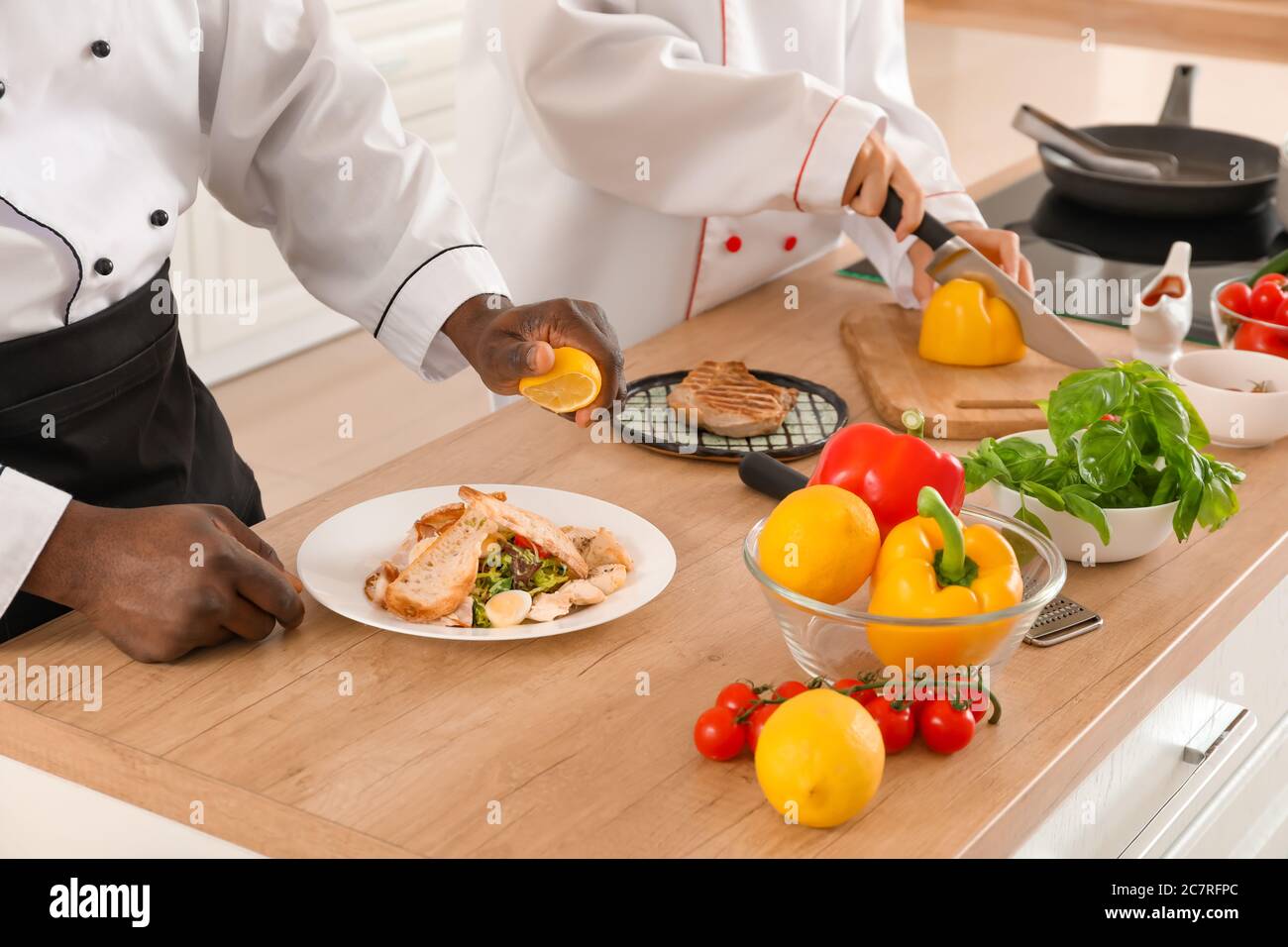 African-American chefs cooking in kitchen Stock Photo - Alamy
