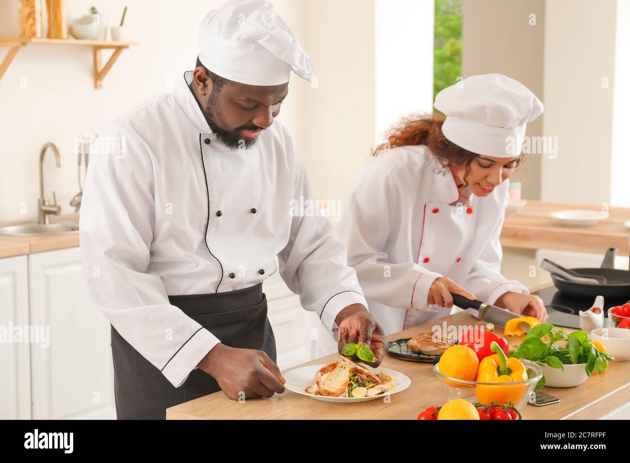 African-American chefs cooking in kitchen Stock Photo - Alamy