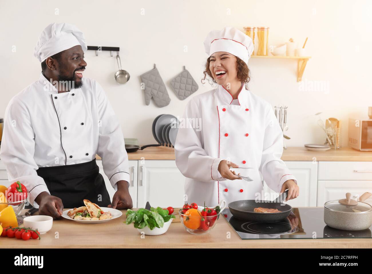 African-American chefs cooking in kitchen Stock Photo - Alamy