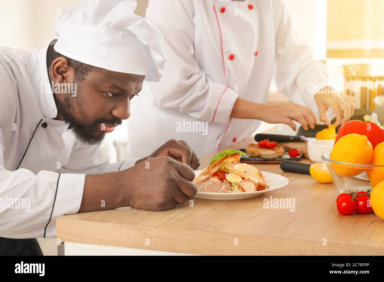 African-American chefs cooking in kitchen Stock Photo - Alamy