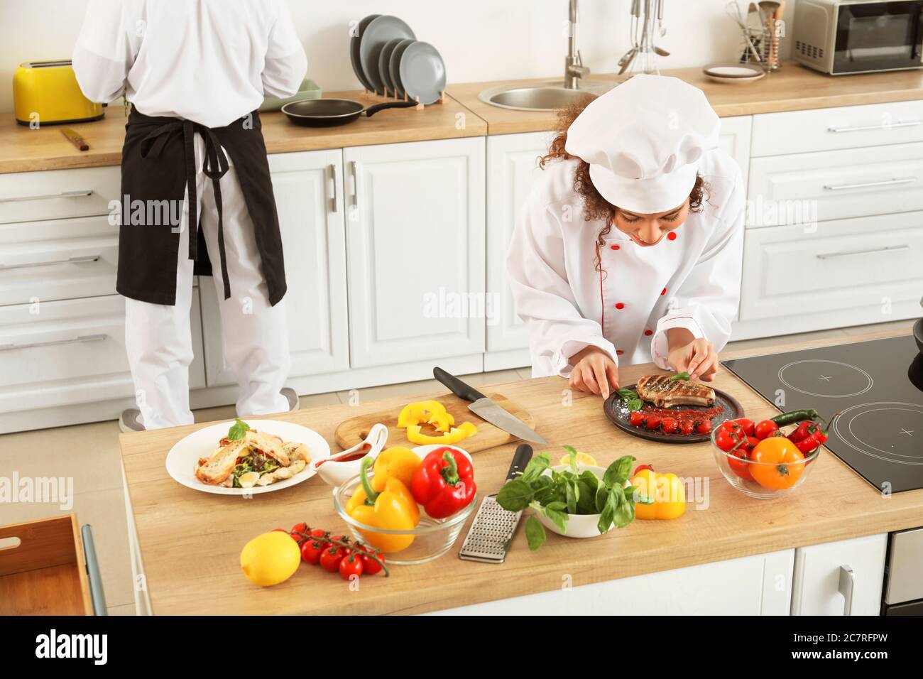 African-American chefs cooking in kitchen Stock Photo - Alamy