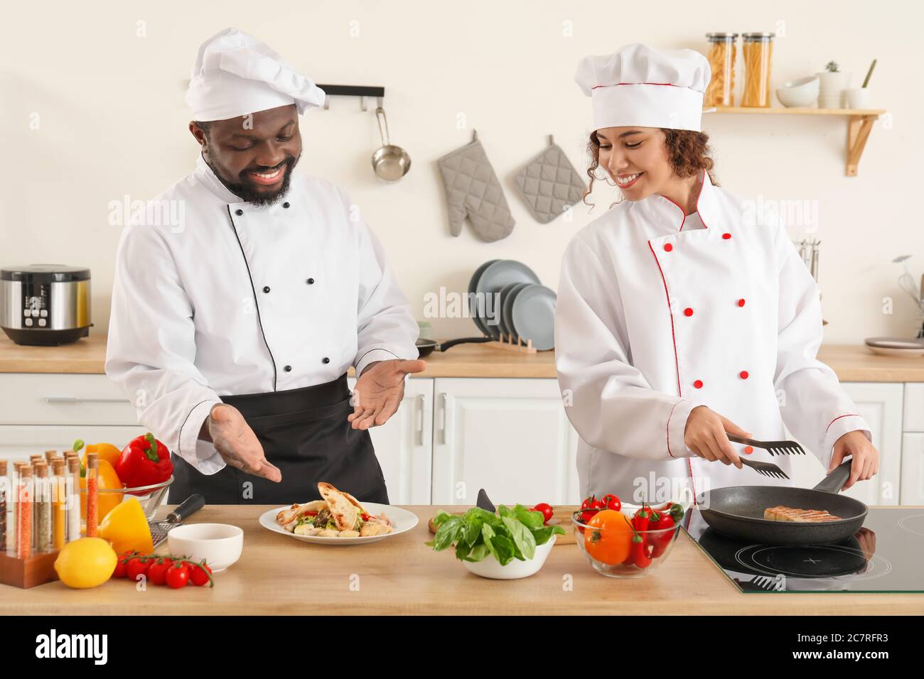 African-American chefs cooking in kitchen Stock Photo - Alamy