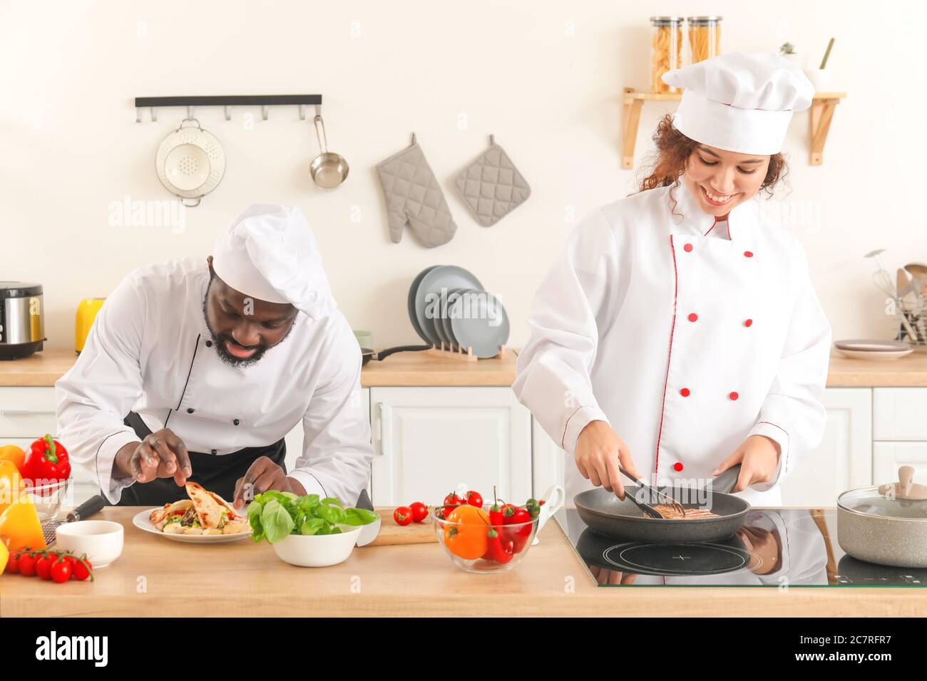 African-American chefs cooking in kitchen Stock Photo - Alamy