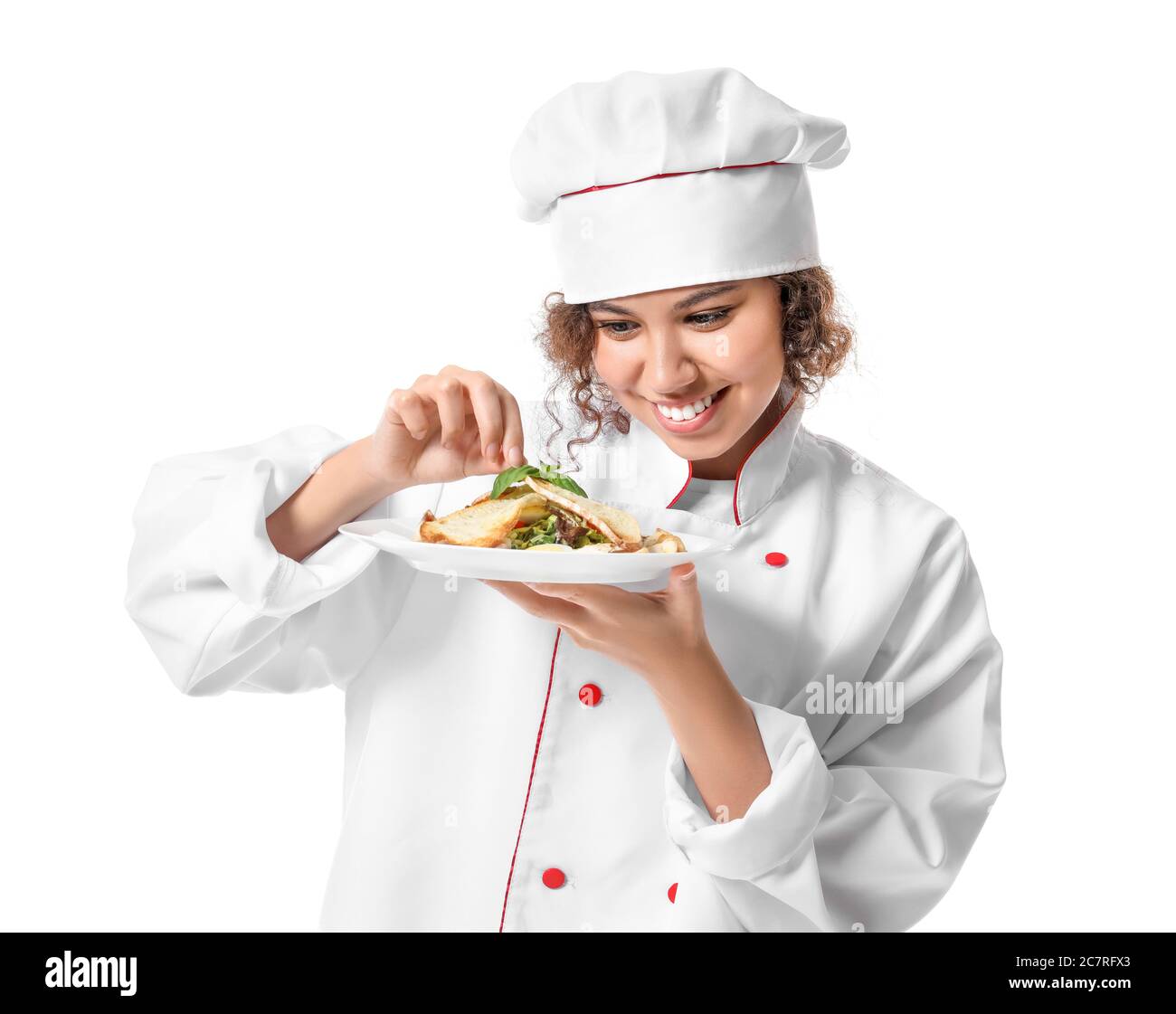 Female African-American chef with tasty dish on white background Stock ...
