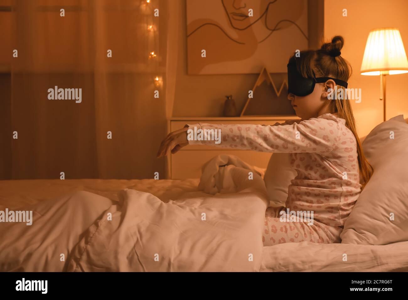 Little sleepwalker in bed at night Stock Photo - Alamy