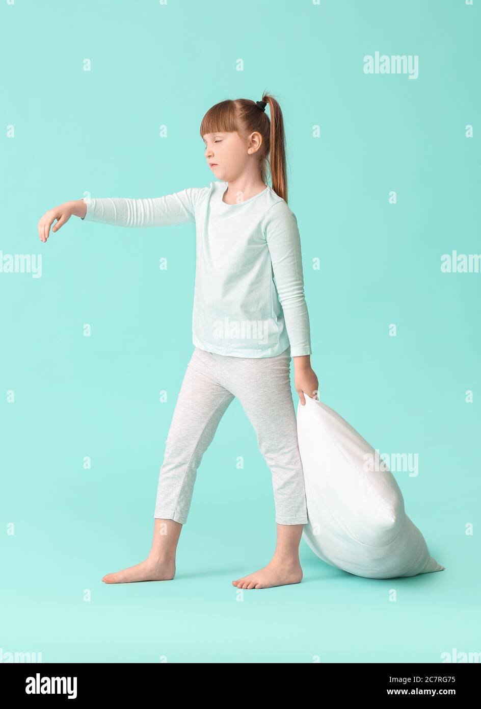Little sleepwalker on color background Stock Photo - Alamy