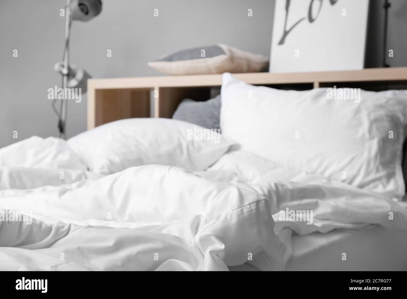 Big comfortable bed in room Stock Photo - Alamy