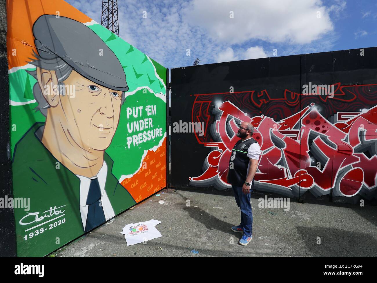 Hugh Dempsey lays a World Cup '94 t-shirt in front of a new mural of ...