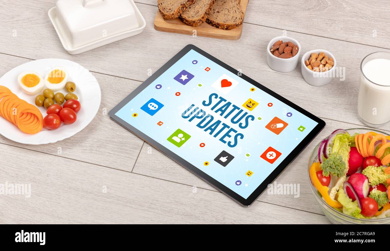 Healthy Tablet Pc compostion with STATUS UPDATES inscription, Social ...