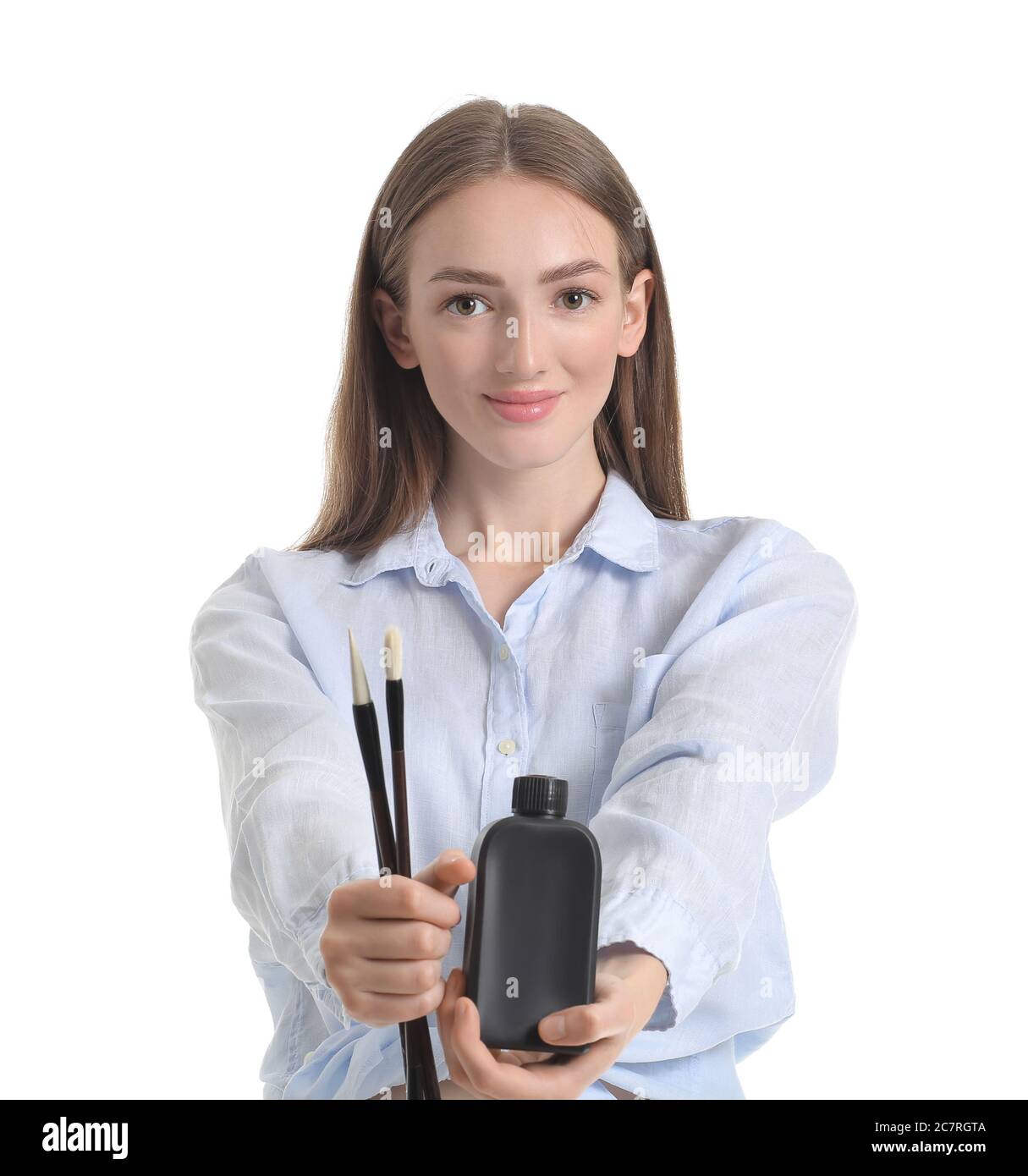 Young female calligraphist on white background Stock Photo - Alamy