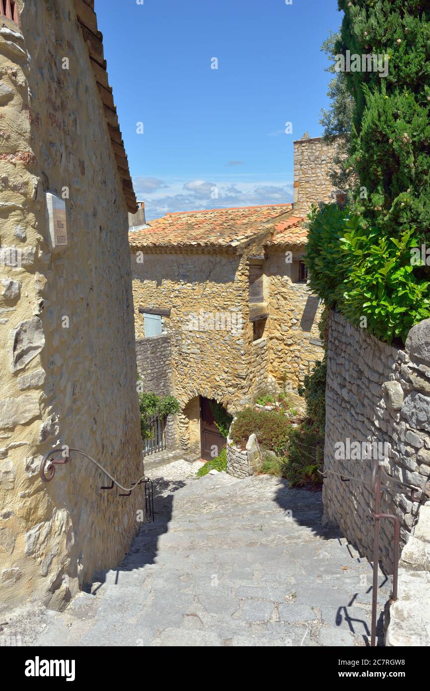 Narrow medieval street - Rue de Soustets in small village Seguret, one ...