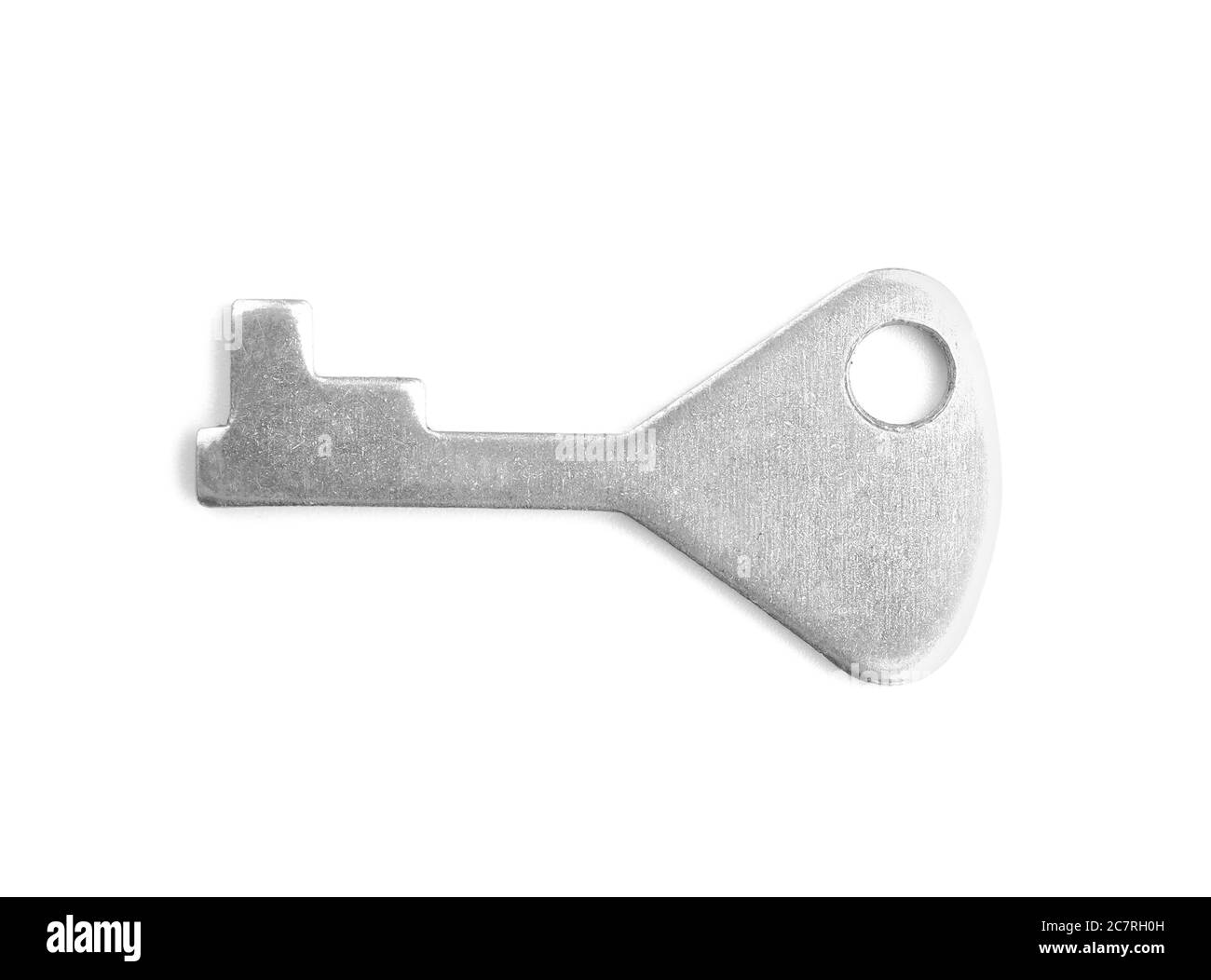Silver key on white background Stock Photo - Alamy