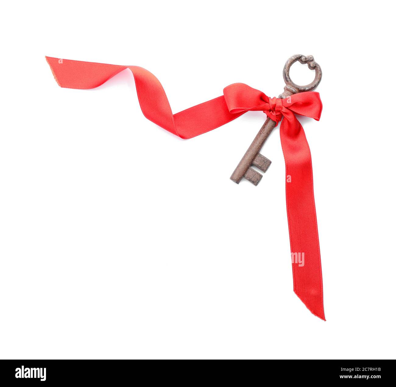 Key with ribbon on white background Stock Photo - Alamy