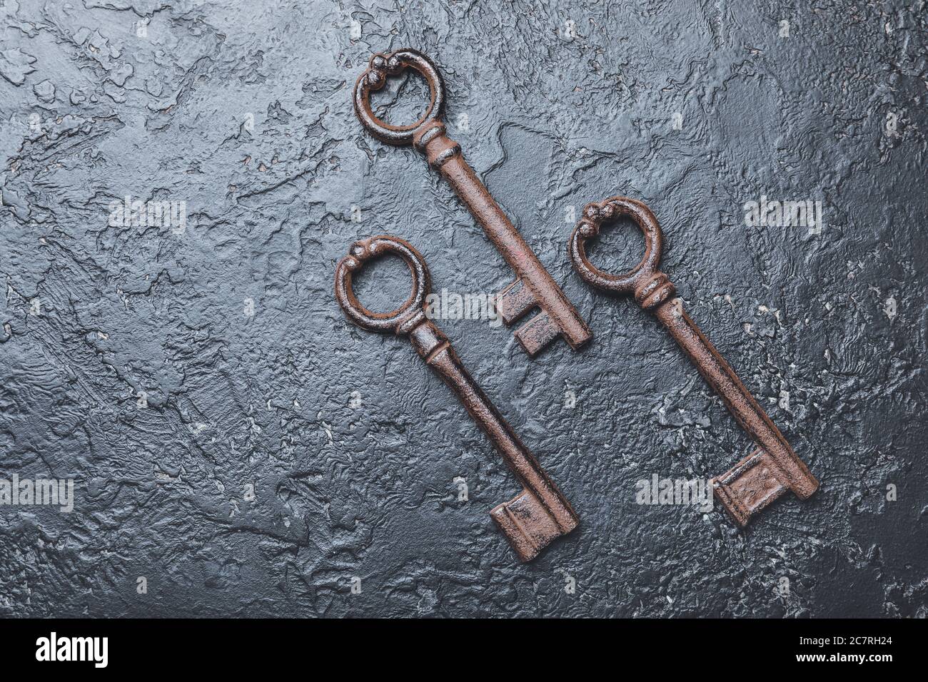 Old keys on dark background Stock Photo - Alamy