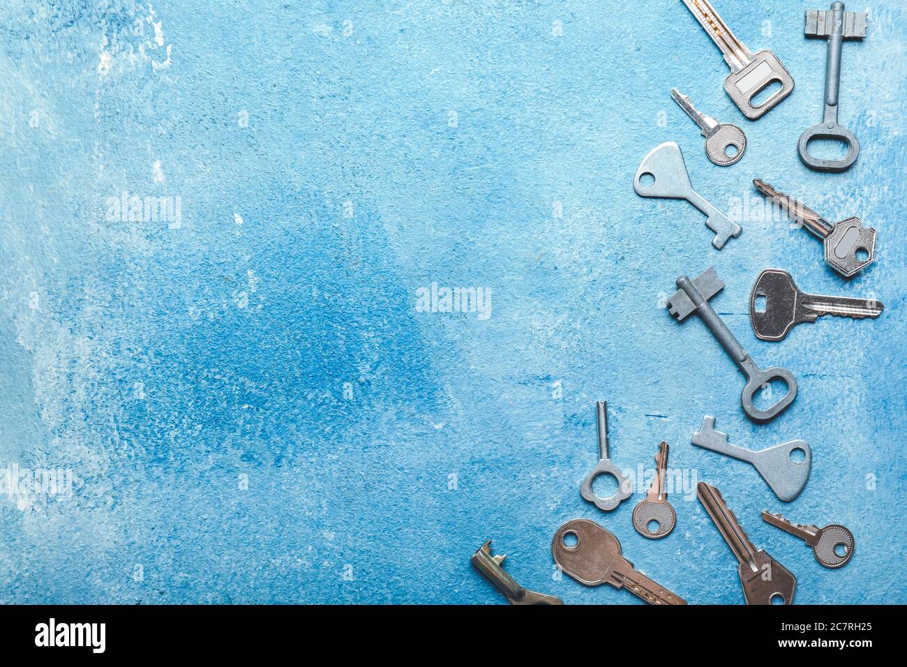 Many keys on color background Stock Photo - Alamy