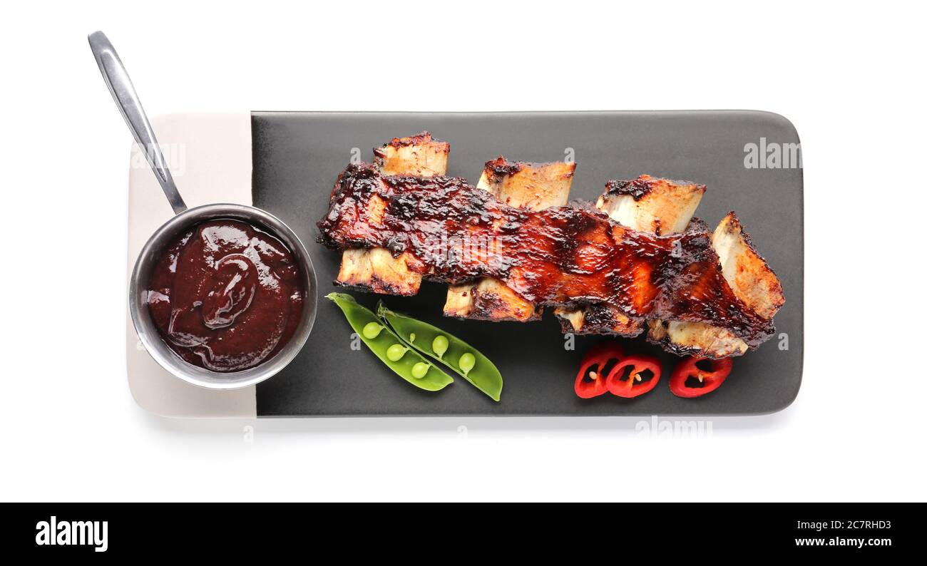 Tasty beef short ribs with sauce on white background Stock Photo - Alamy