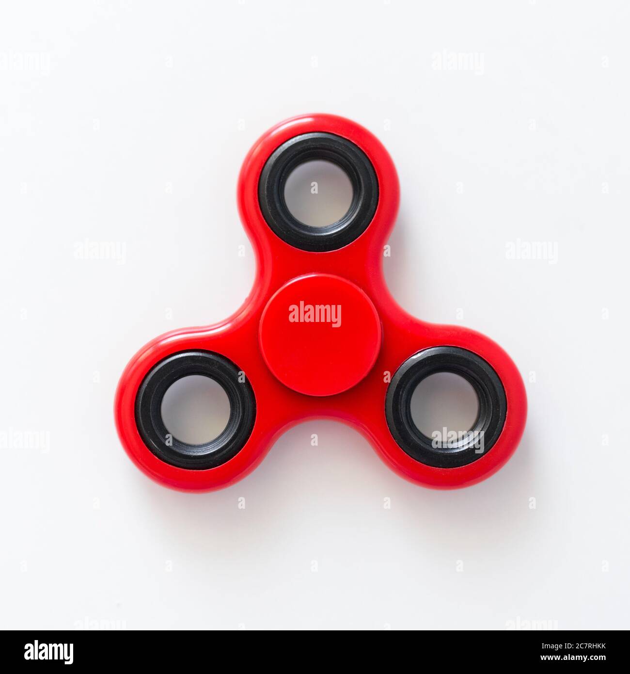 popular toy fidget spinner over white background Stock Photo - Alamy
