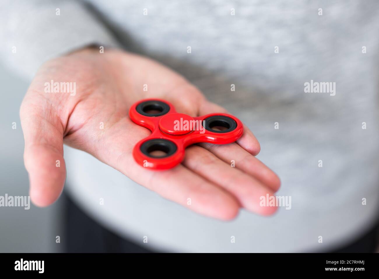 Man holding modern spinner hi-res stock photography and images - Alamy