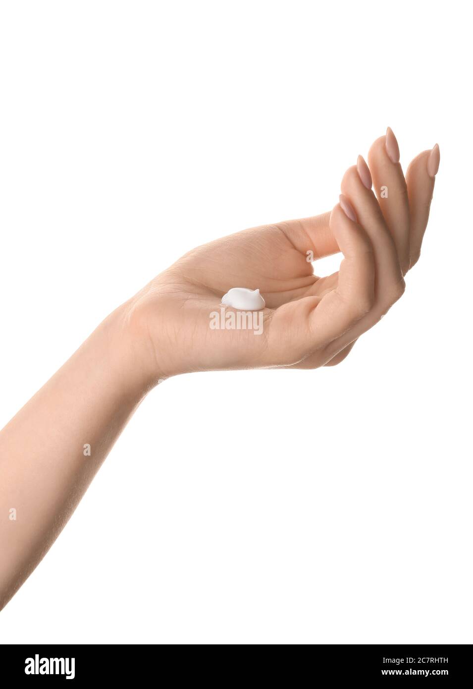 Beautiful young woman applying hand cream against white background ...