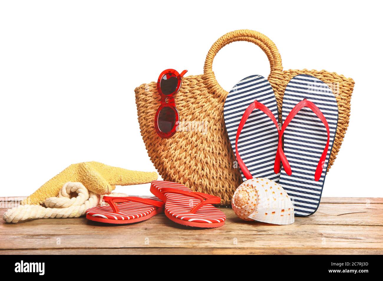 Set of beach accessories on table against white background Stock Photo ...