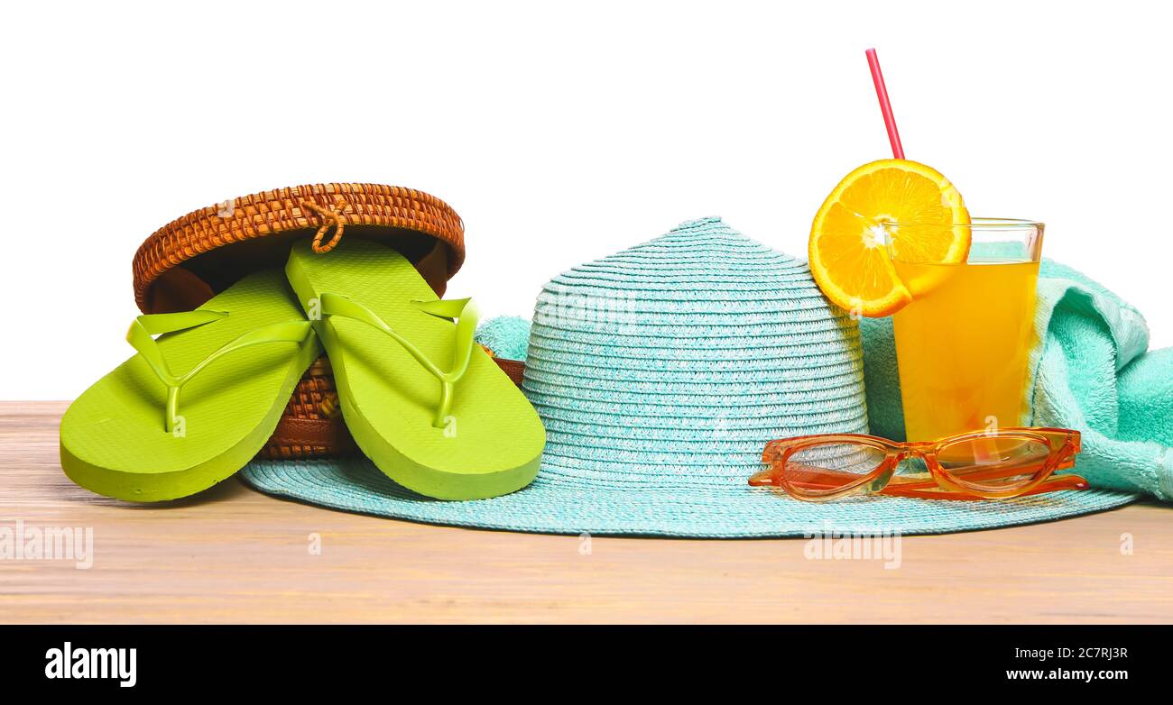 Set of beach accessories on table against white background Stock Photo ...