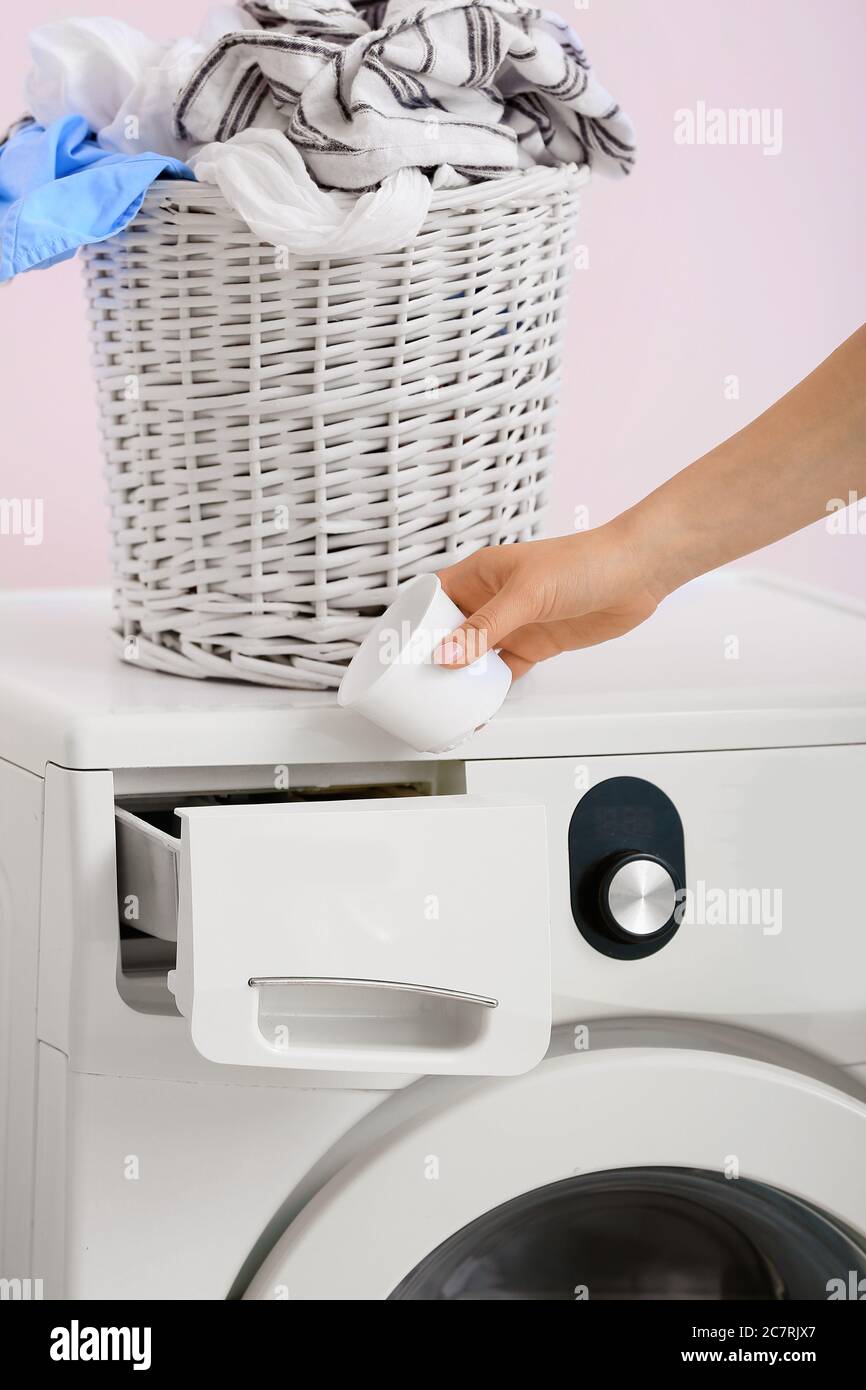 Woman doing laundry at home Stock Photo - Alamy