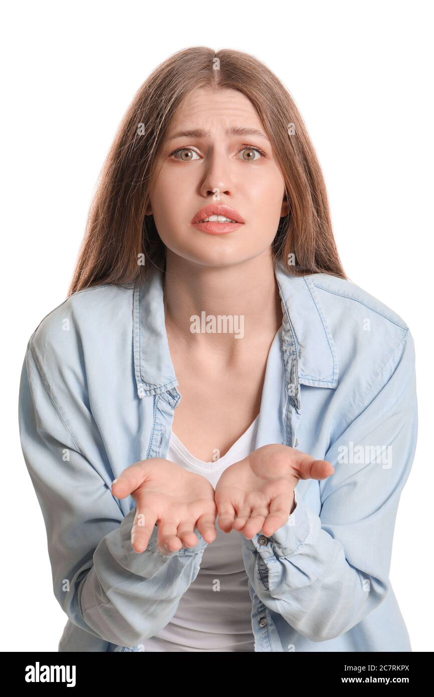 Apologizing young woman on white background Stock Photo - Alamy