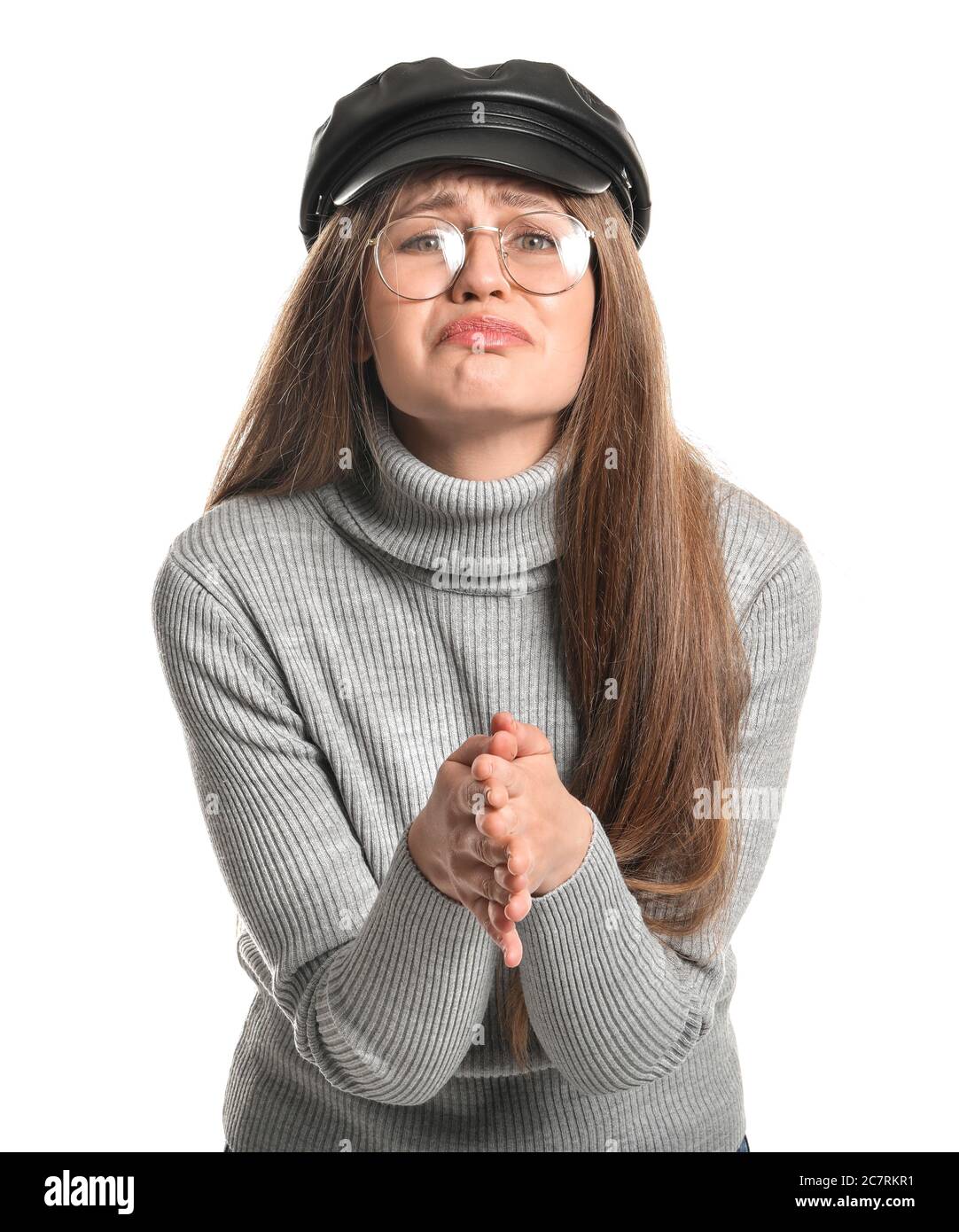 Apologizing young woman on white background Stock Photo - Alamy