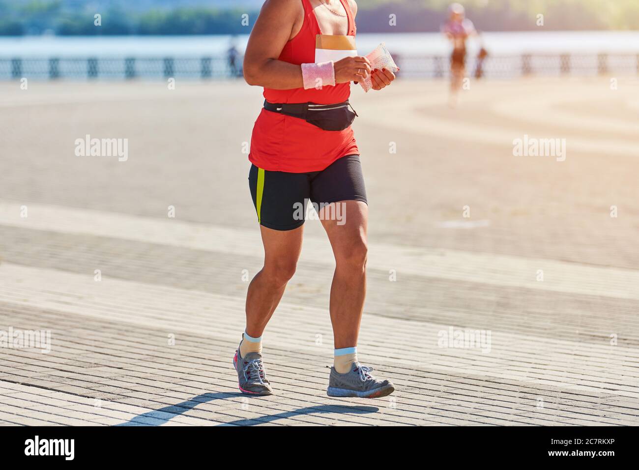 Running woman. Fitness woman jogging in sportswear on city road ...